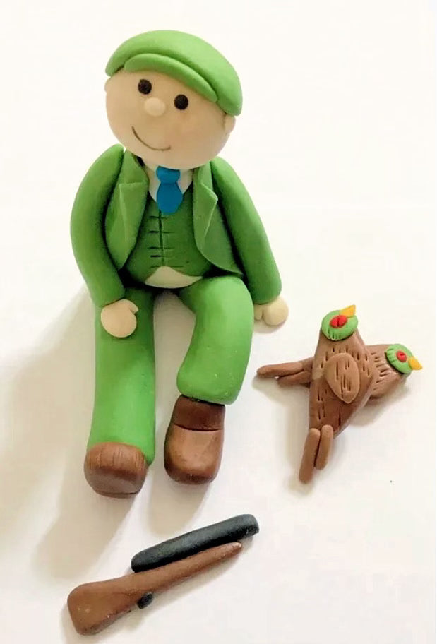 Edible gamekeeper cake topper
